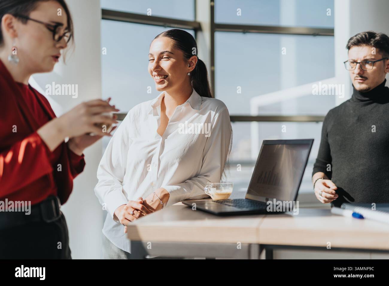 Business employees chatting casually in office kitchen break area Stock ...