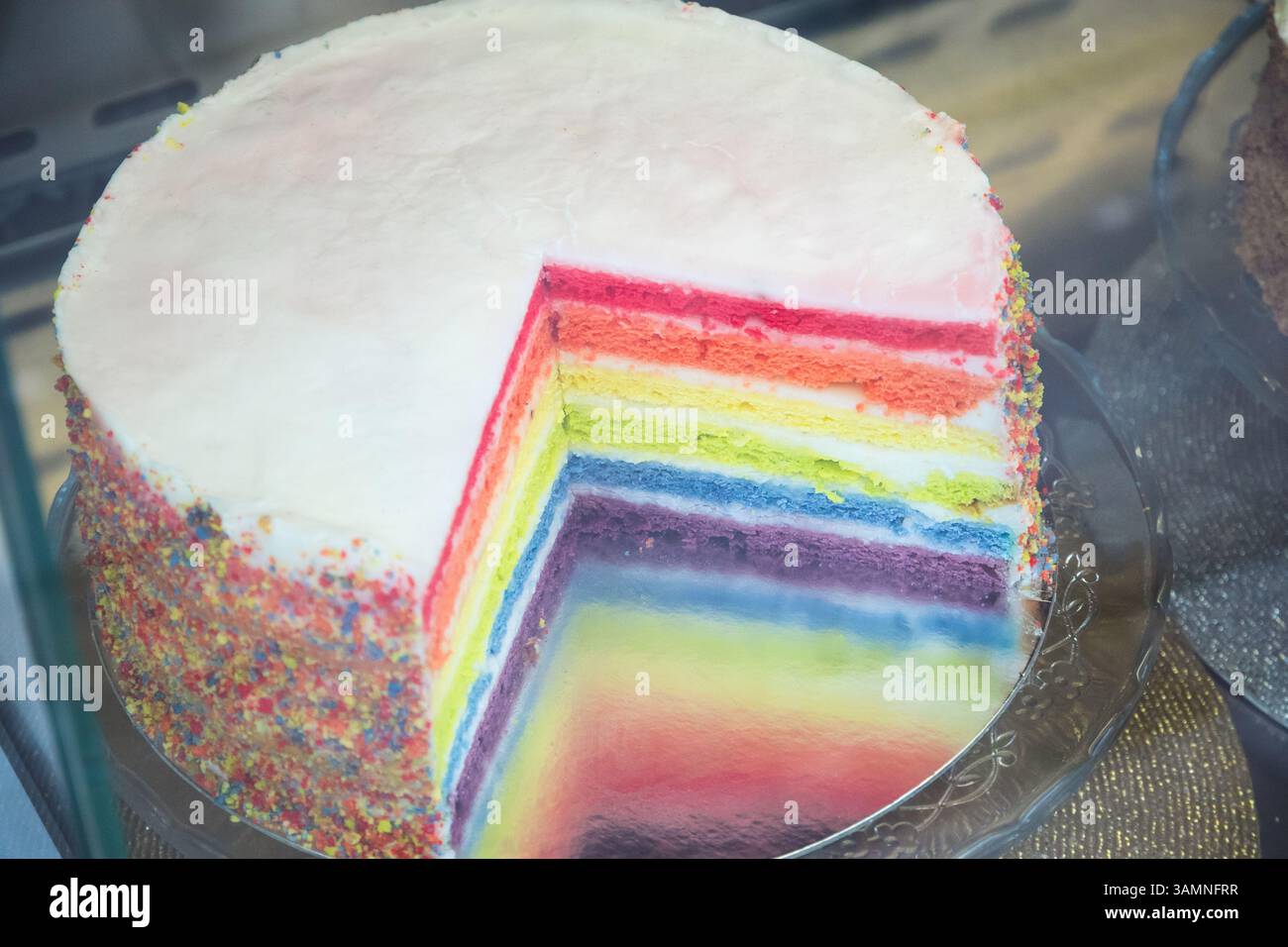 Colourful rainbow cake on display at Brick Lane market in London Stock ...