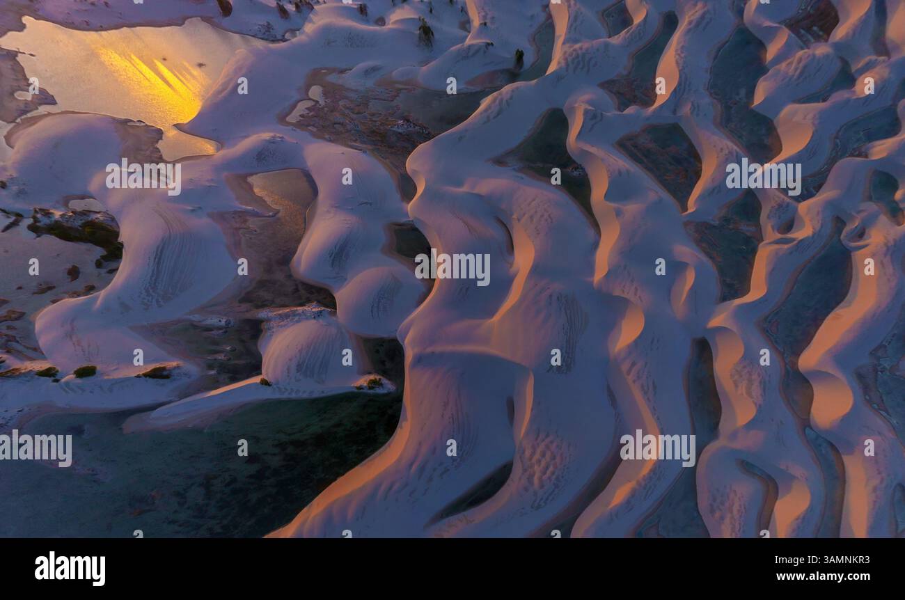 Aerial view of the last rays of the sun over the desert Lençóis, Brazil ...