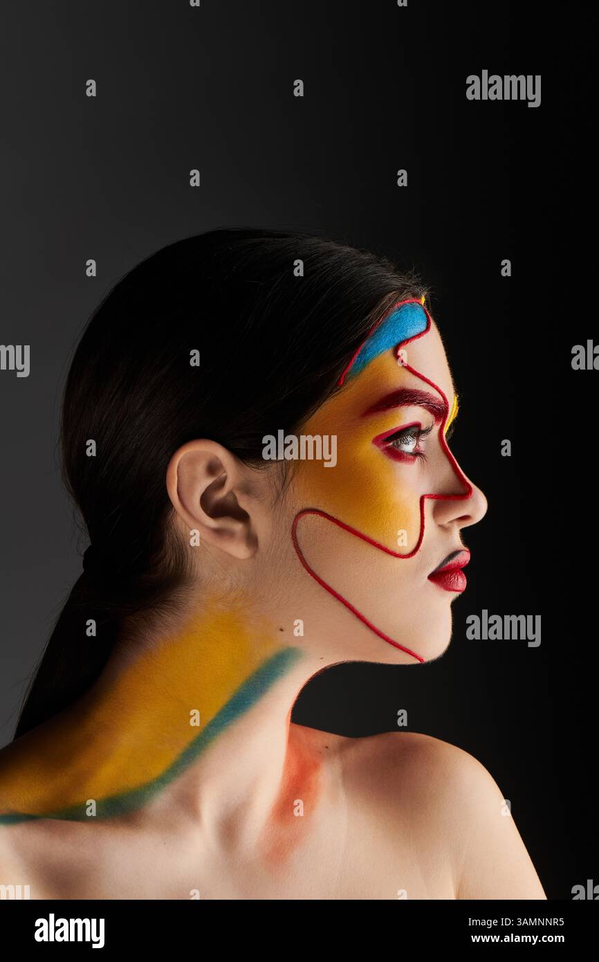 A young beautiful woman displays stunning face art featuring vibrant ...