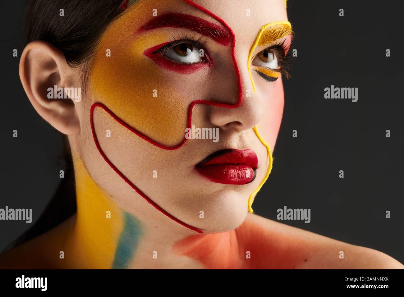 Bold, bright colors and designs on a young womans face make a striking ...