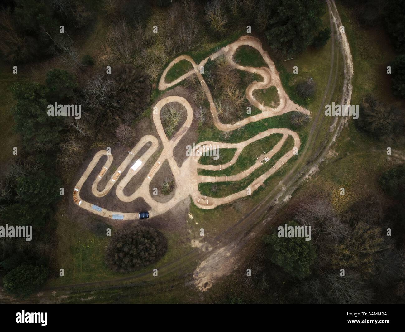 Aerial view of a beautiful sport complex with winding track surrounded ...