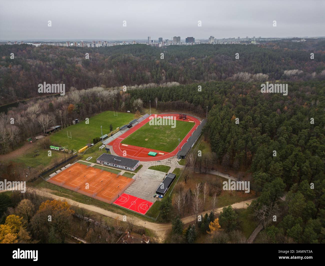 Aerial view of Vingio park featuring a beautiful forest, sports field ...