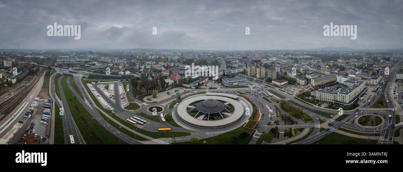 Aerial view of panoramic bus station surrounded by modern buildings and ...