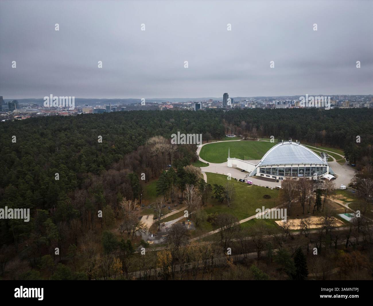 Aerial view of tranquil Vingio park with lush greenery and a dome ...