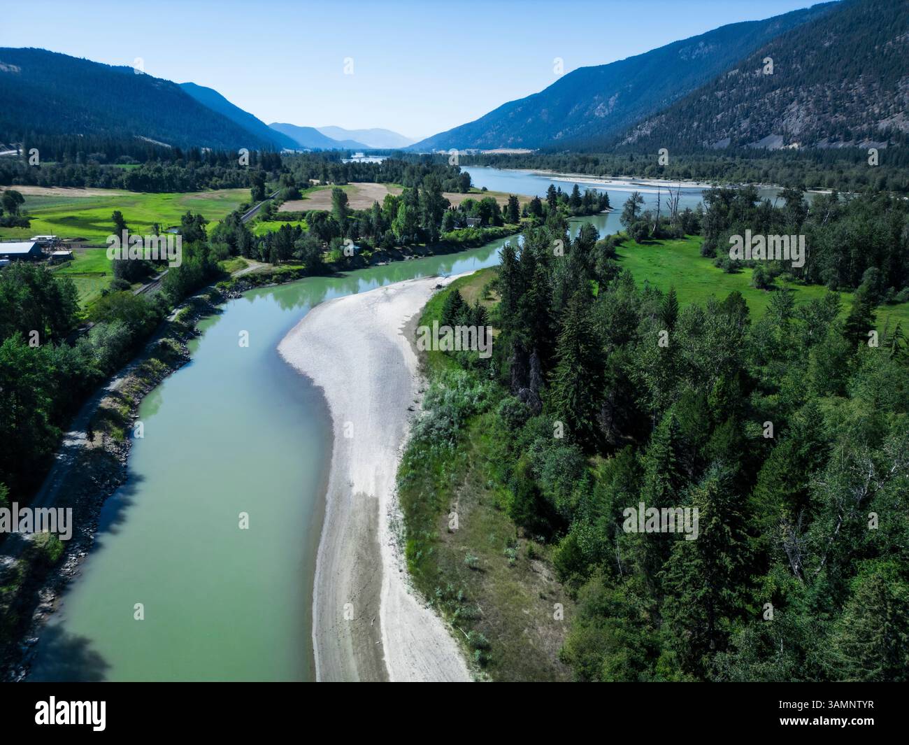 Aerial view of the serene North Thomson river winding through lush ...