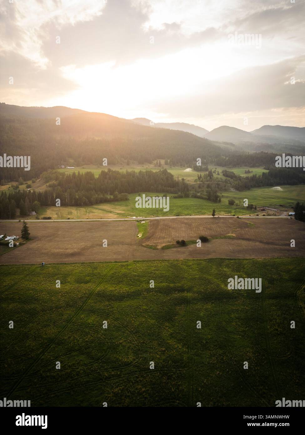 Aerial view of serene sunset over beautiful mountains and expansive ...