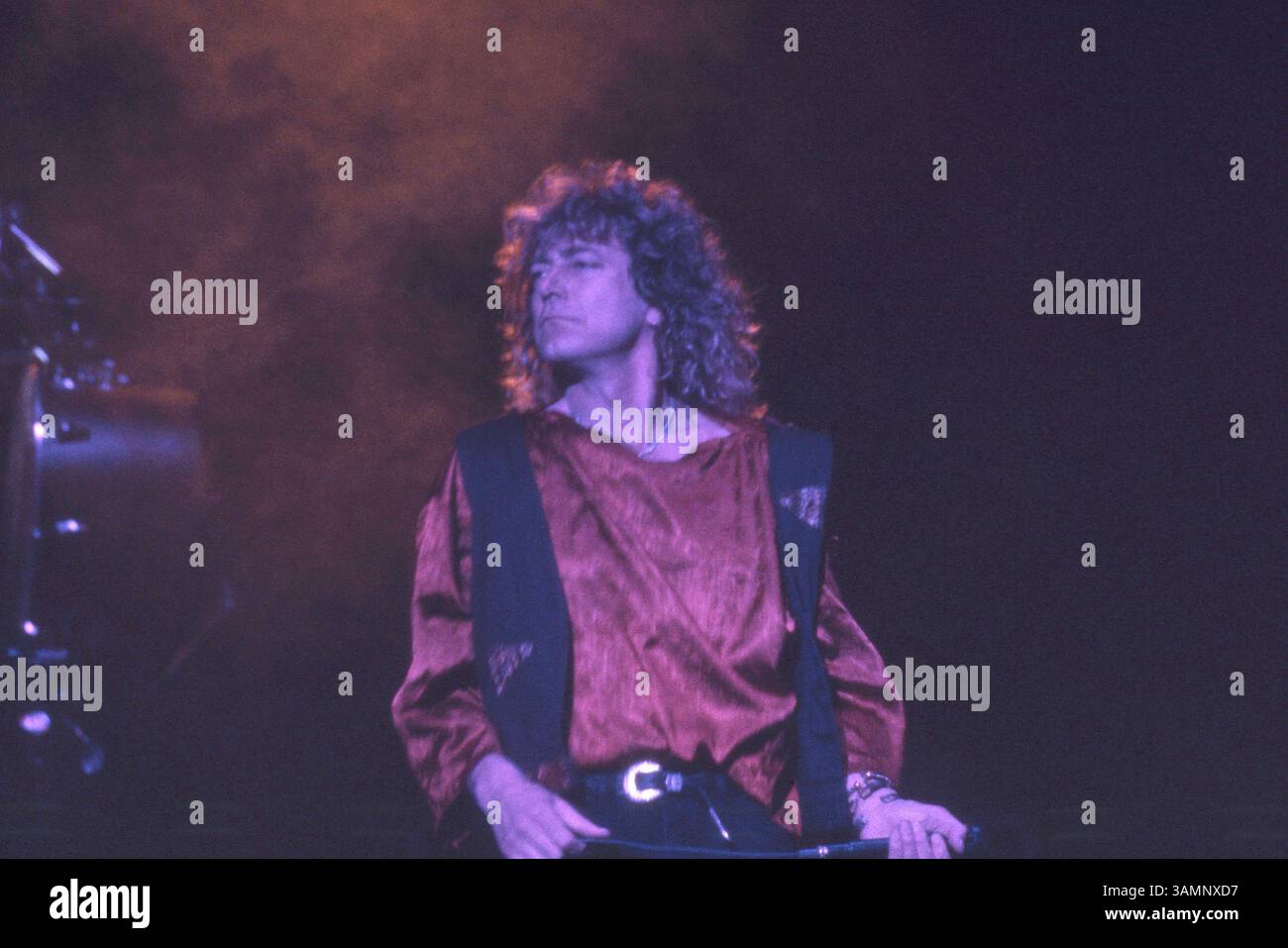 Robert Plant playing at the Hammersmith Odeon, London in the late 1980s ...