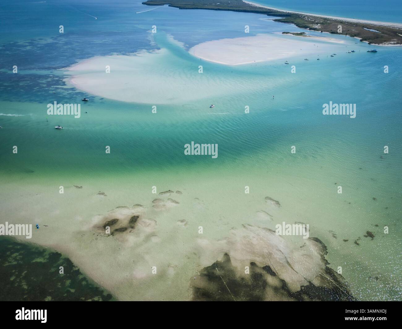 Aerial view of colorful coral reef and sandbanks at Hurricane Pass with ...