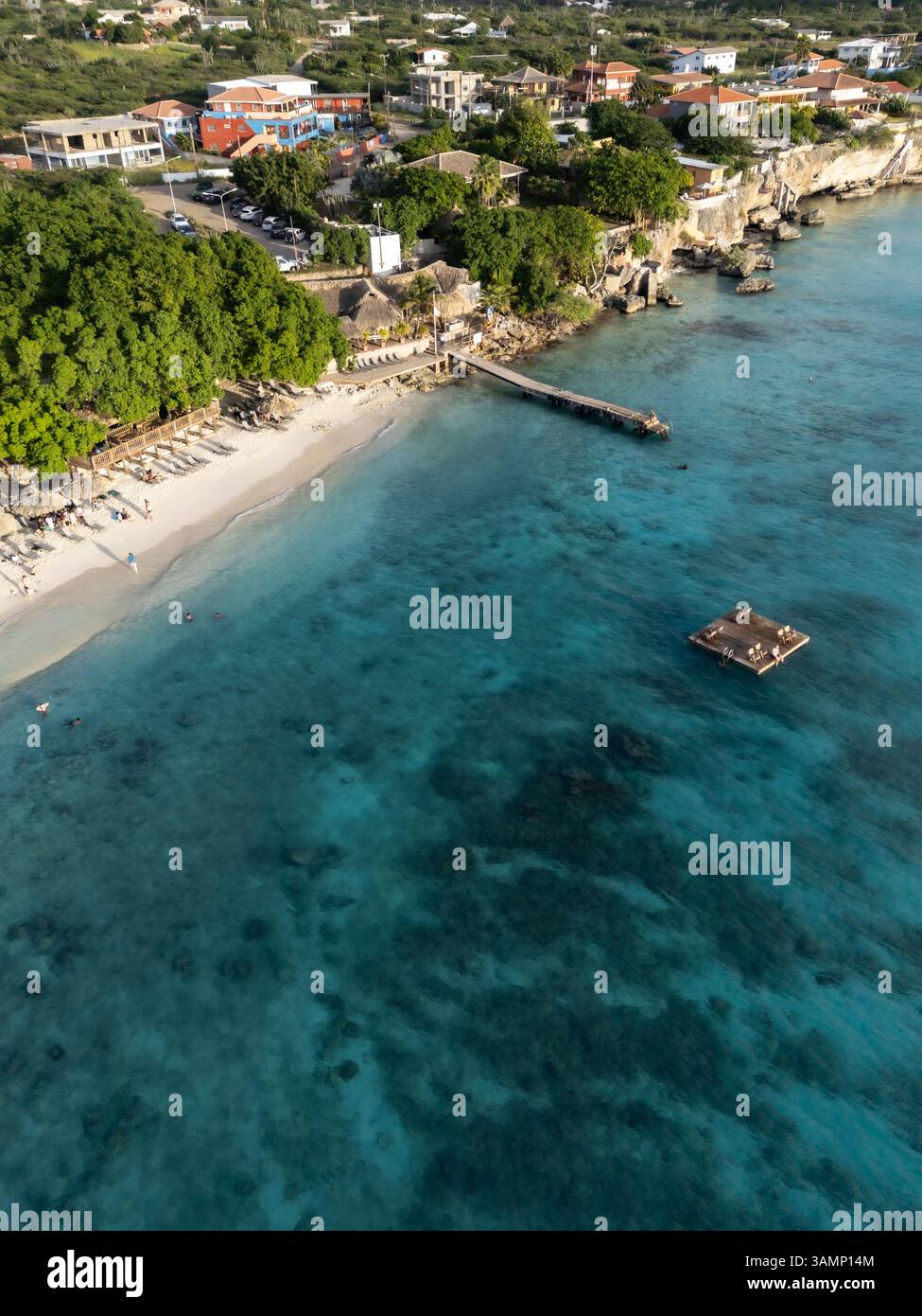 Aerial view of tropical paradise with azure waters and coastal village ...