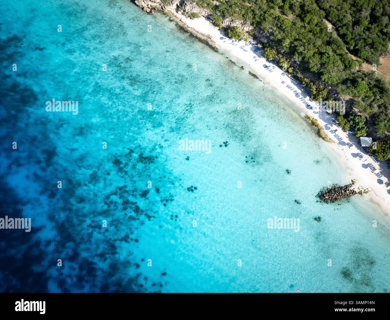 Aerial view of tropical beach with clear water and lush trees, Porto ...