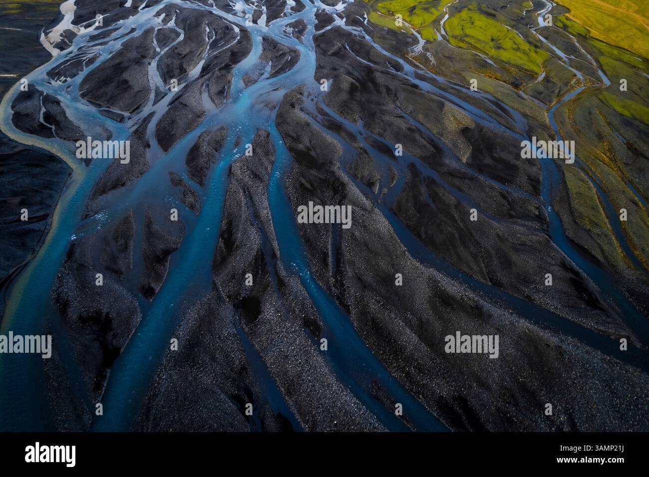 Aerial view of glacier rivers and river patterns in volcanic terrain ...