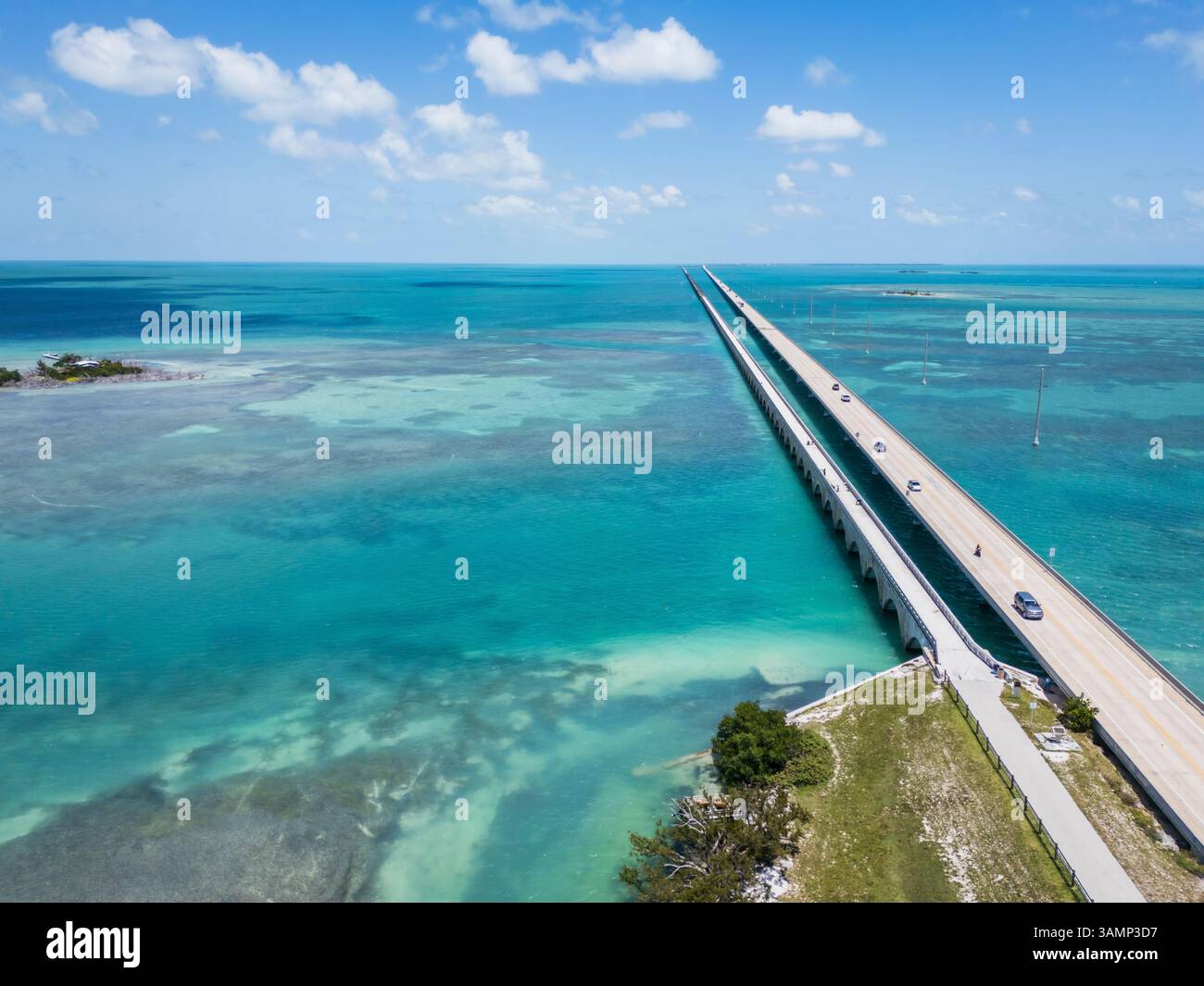 Aerial view of road to Key West with turquoise water and small island ...
