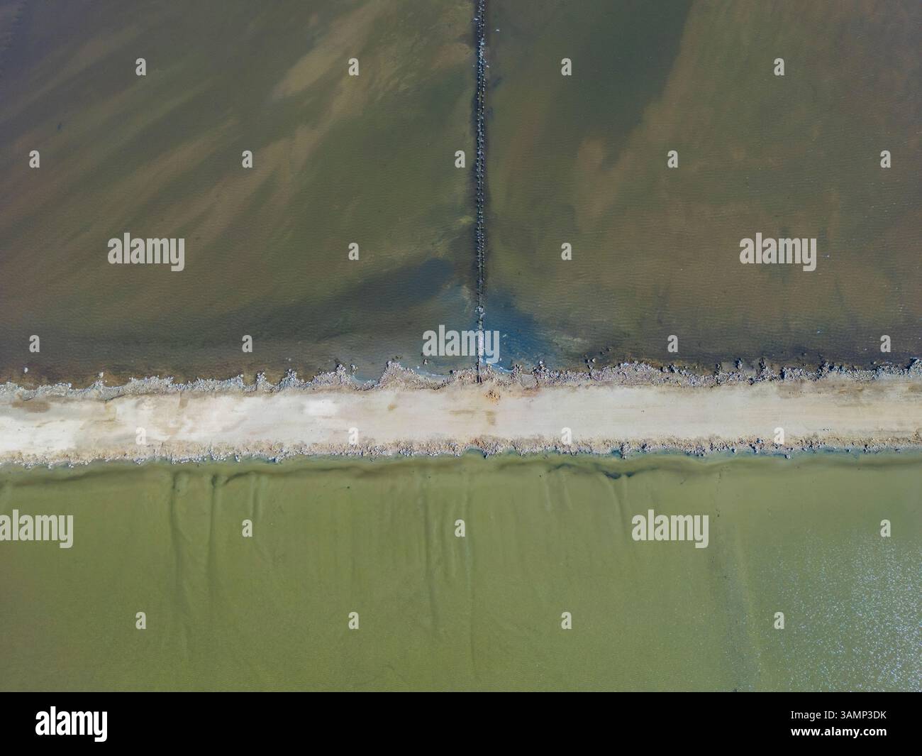 Aerial view of salt lakes with contrasting green and brown water, Santa ...