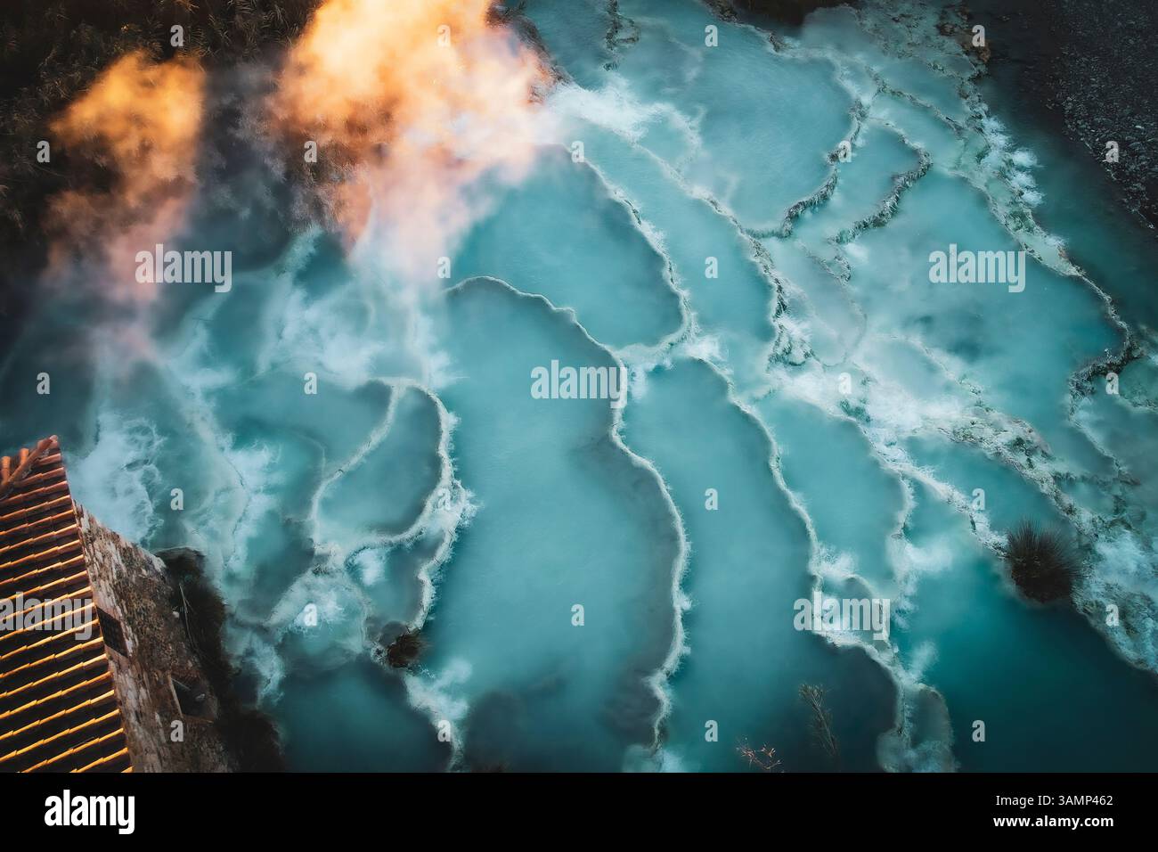 Aerial view of geothermal pool and stone house at Terme di Saturnia ...