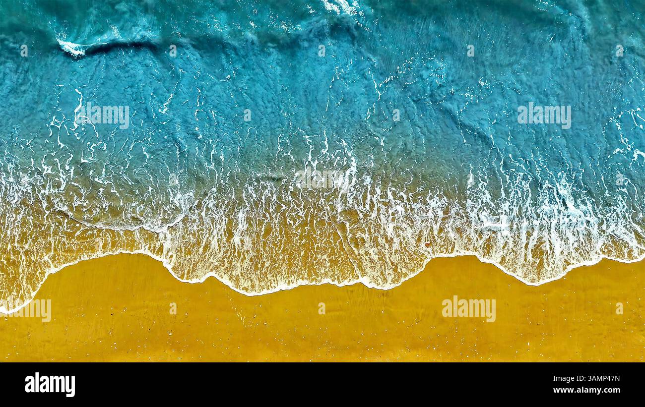 Aerial View of Ocean Waves on Sandy Beach. Top-down view of turquoise ...