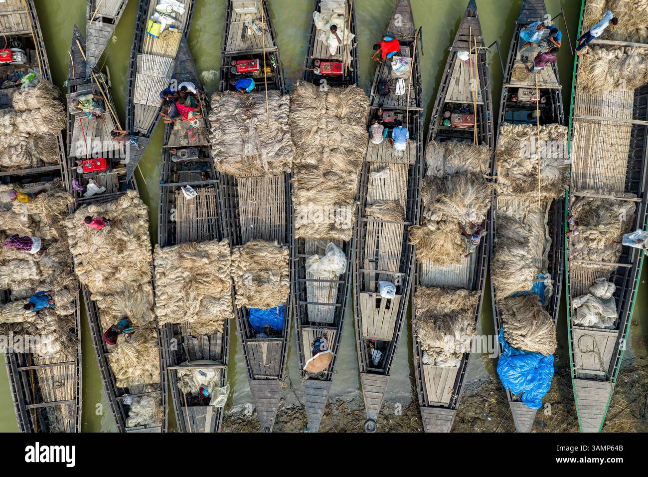 Aerial view of the raw jute market with traditional wooden boats and ...