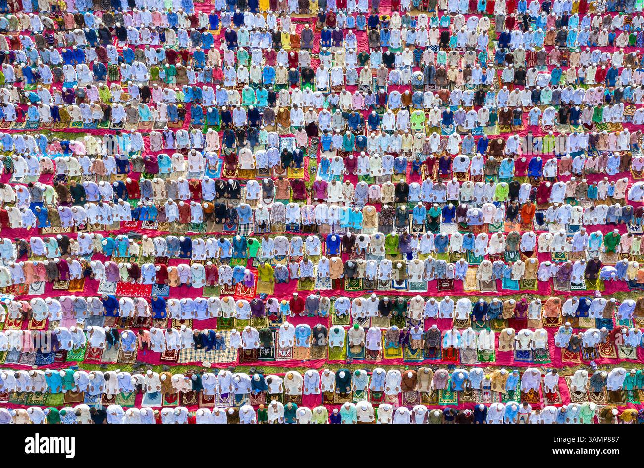 Aerial view of eid prayer gathering with a large crowd of devotees in a ...