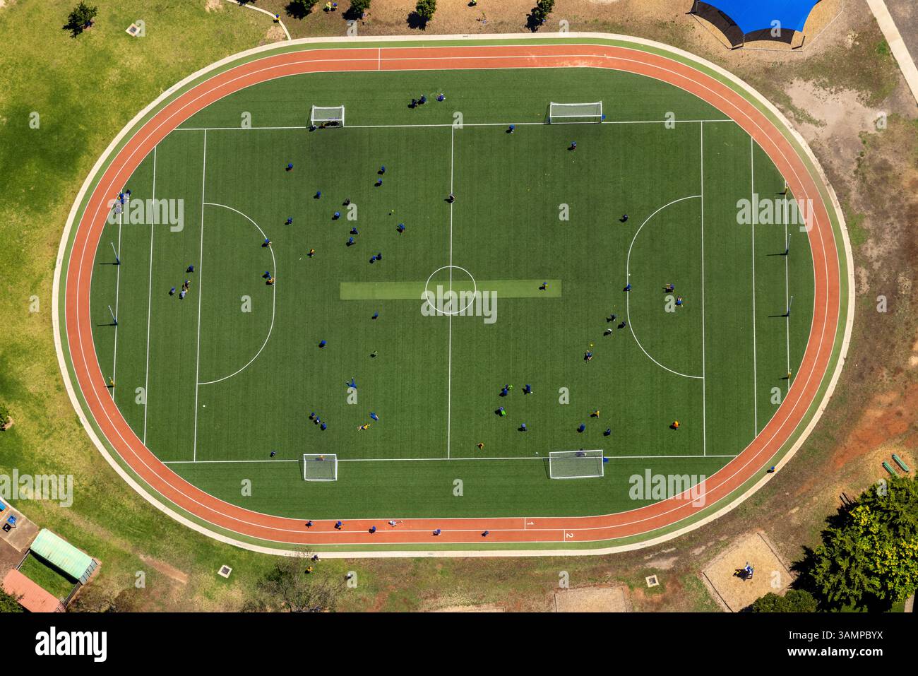 Aerial view of a vibrant soccer field with players in action and a ...
