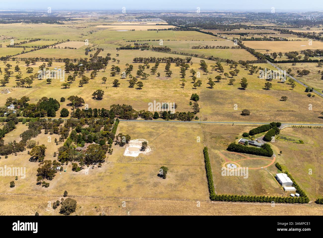 Aerial view of beautiful agricultural fields and lush woodlands ...