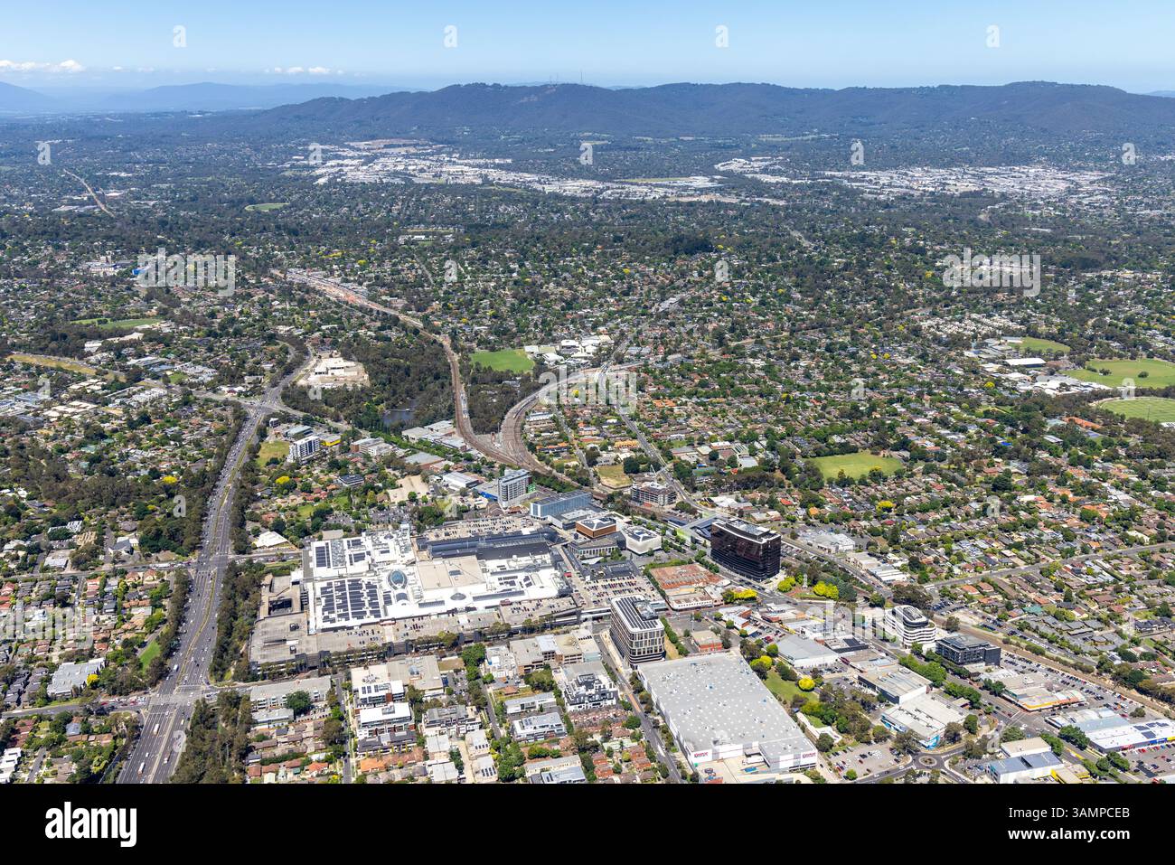 Aerial view of vibrant cityscape with modern buildings and greenery in ...