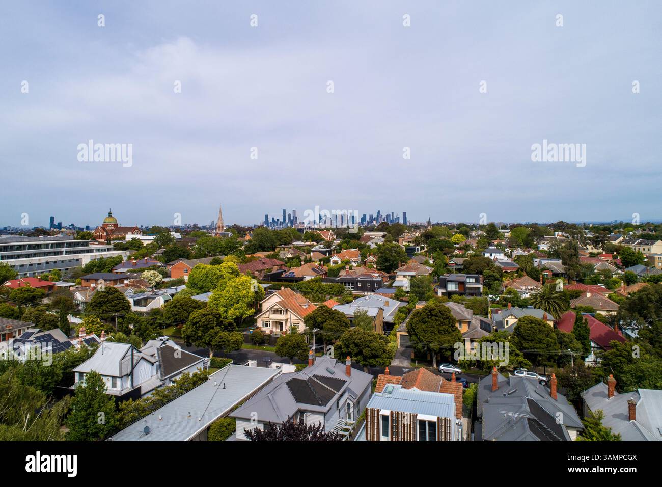 Aerial view of beautiful suburban houses and greenery with a skyline ...
