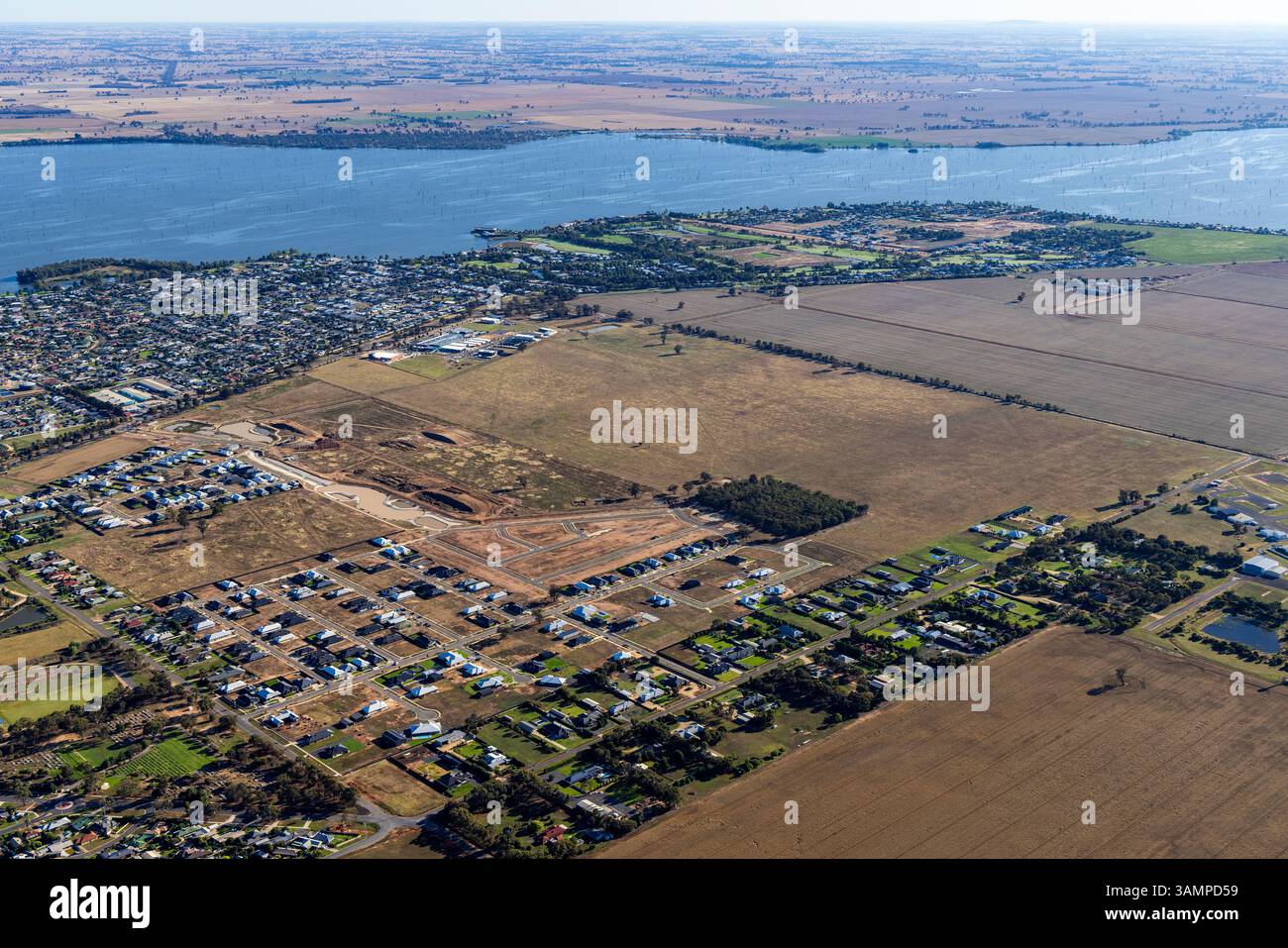 Aerial view of beautiful Yarrawonga with lake, homes, and farmland in ...