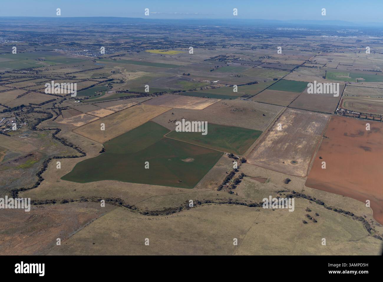 Aerial view of expansive farmland with patchwork patterns in serene ...