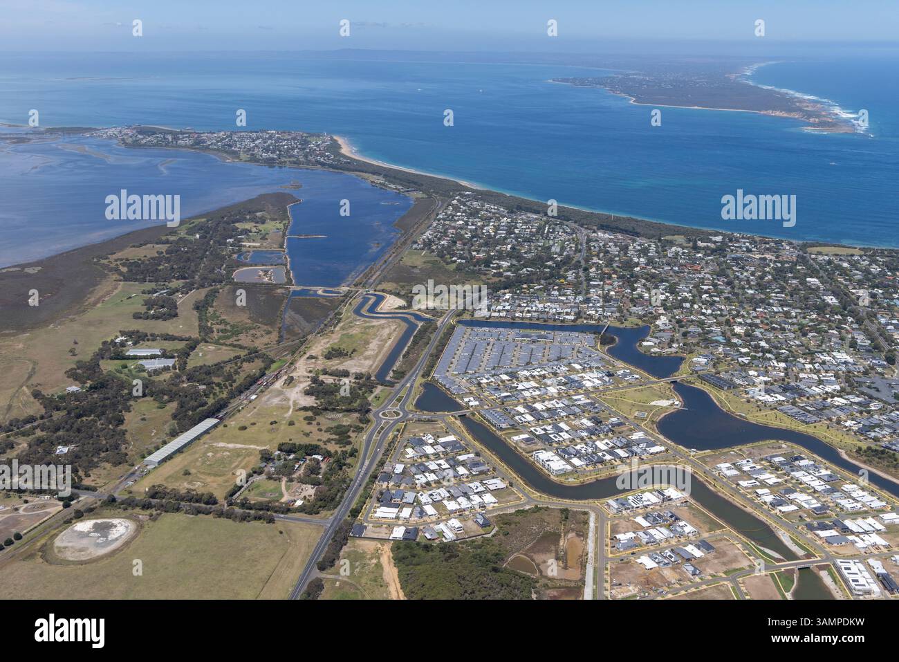 Aerial view of beautiful coastal town with residential area and ocean ...