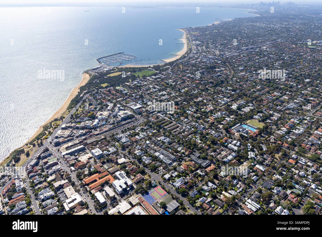 Aerial view of beautiful coastal residential area with beach and ocean ...