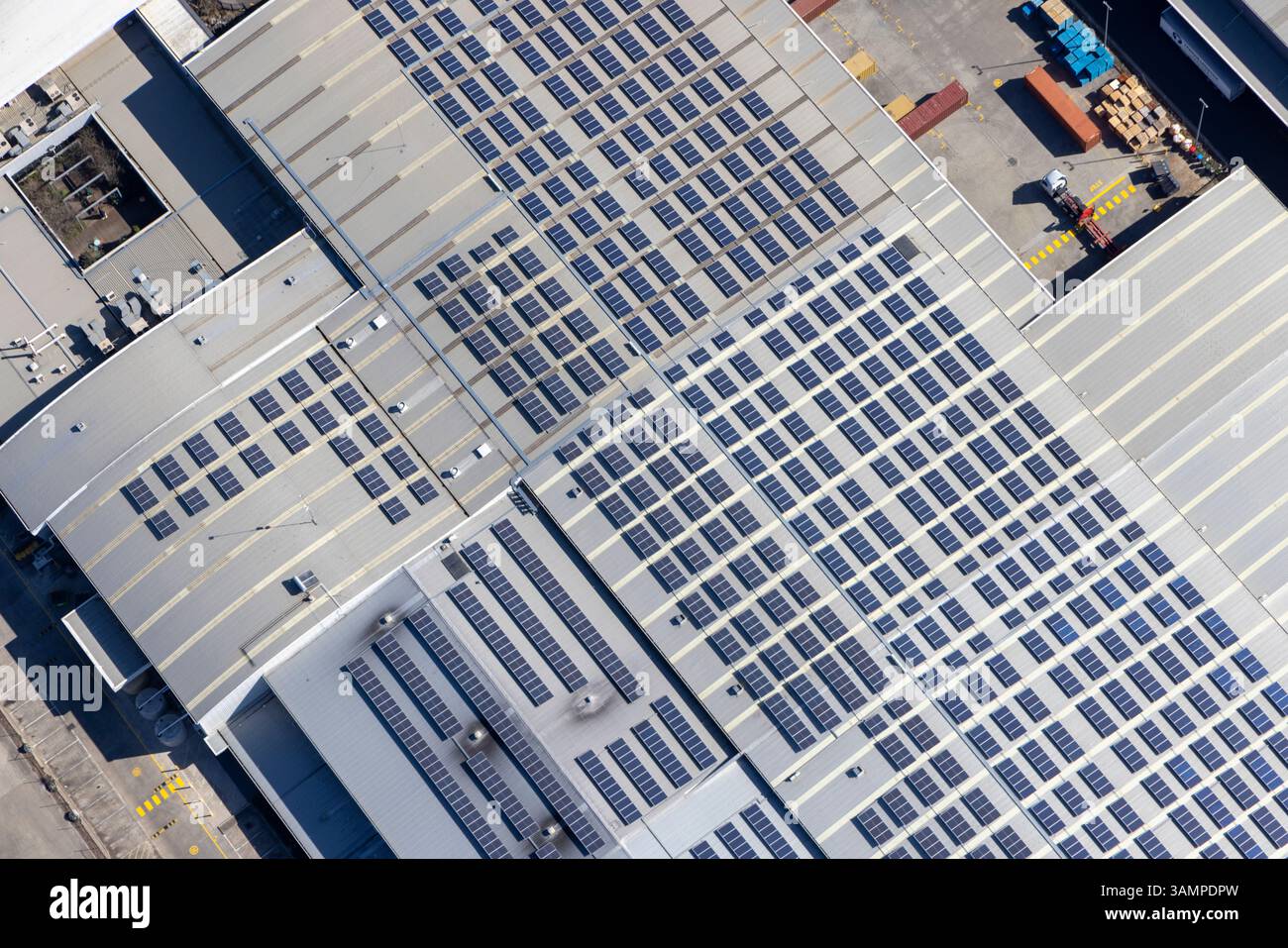 Aerial view of solar panel roofs on modern buildings, Derrimut ...