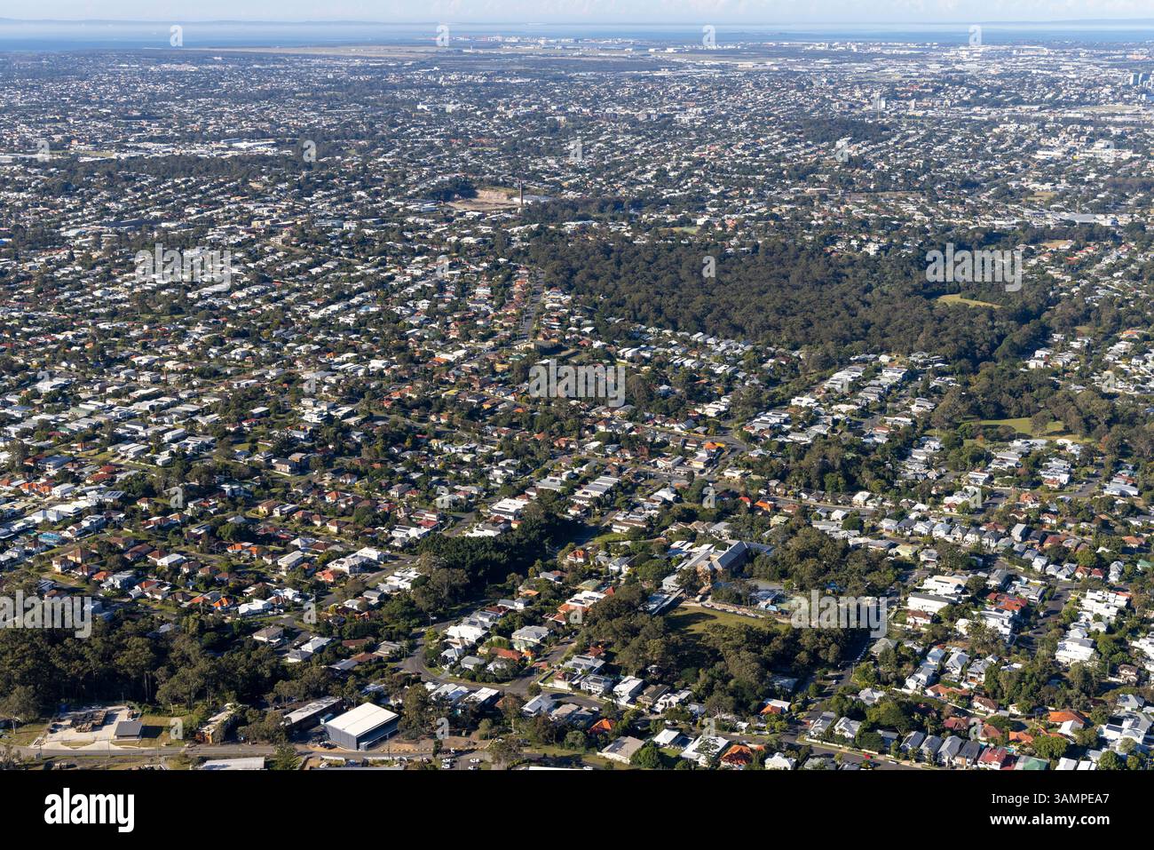 Aerial view of sprawling residential suburb with greenery and homes ...