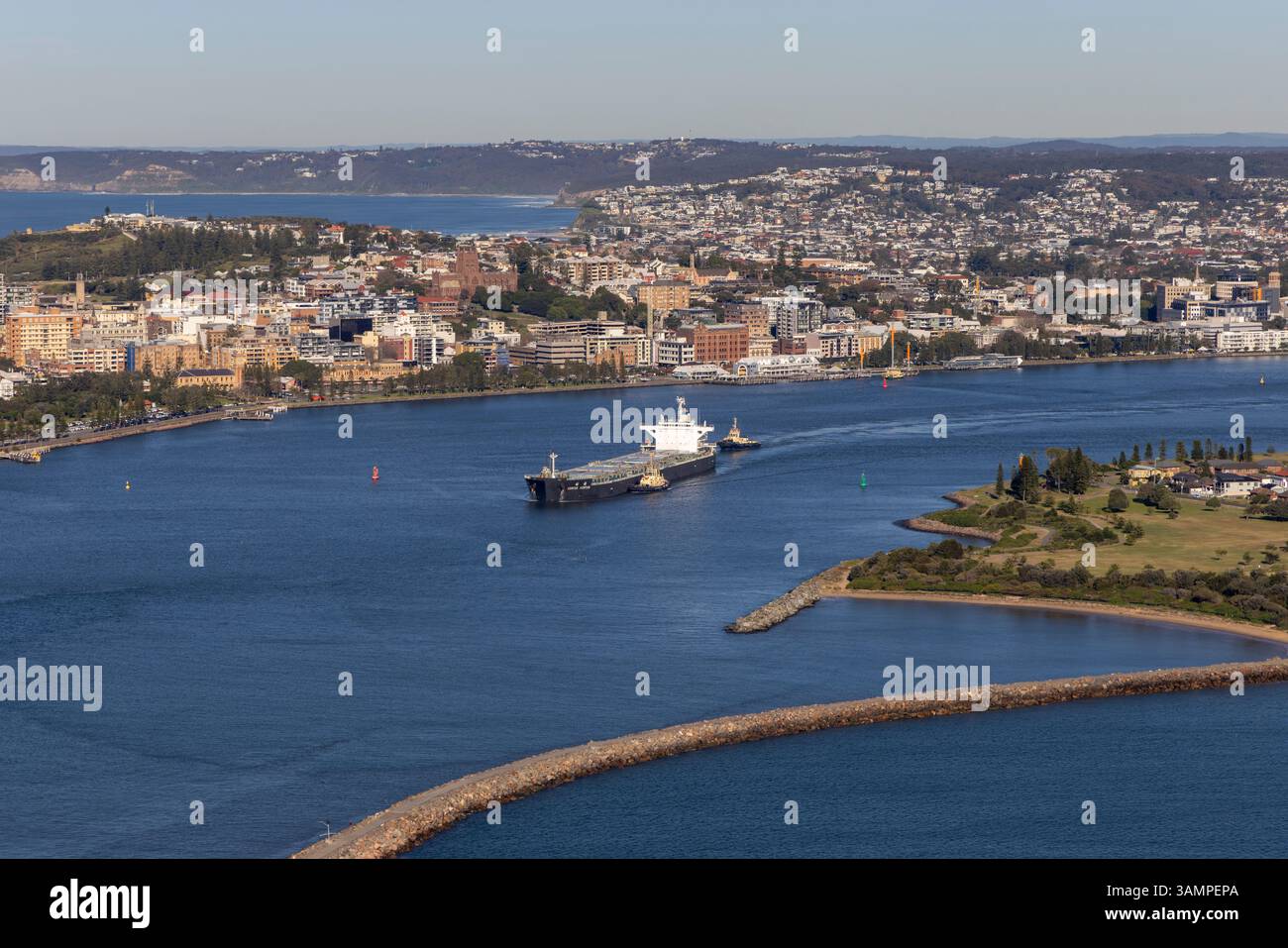 Aerial view of the beautiful coastal cityscape with a harbor and cargo ...
