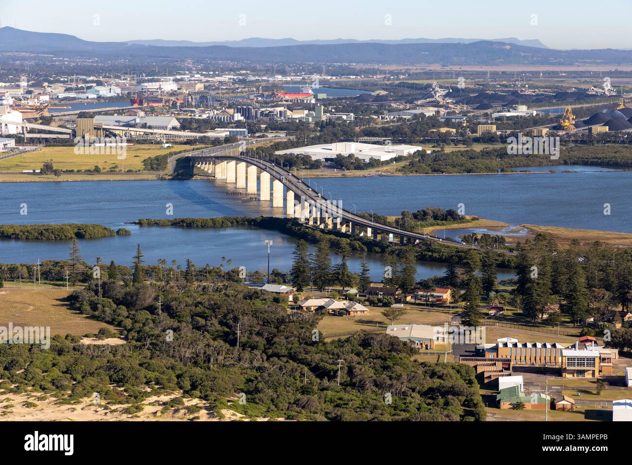 Aerial view of a beautiful cityscape featuring a bridge spanning a ...