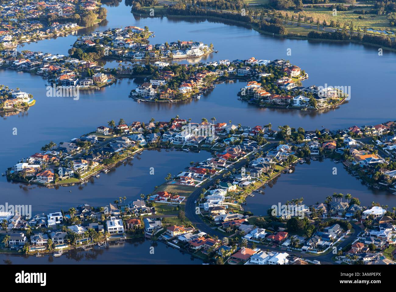 Aerial view of beautiful residential houses and tranquil canals with a ...