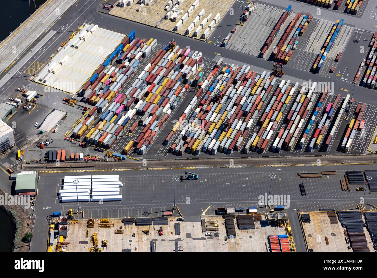 Aerial view of a busy harbour filled with stacked containers and cargo ...