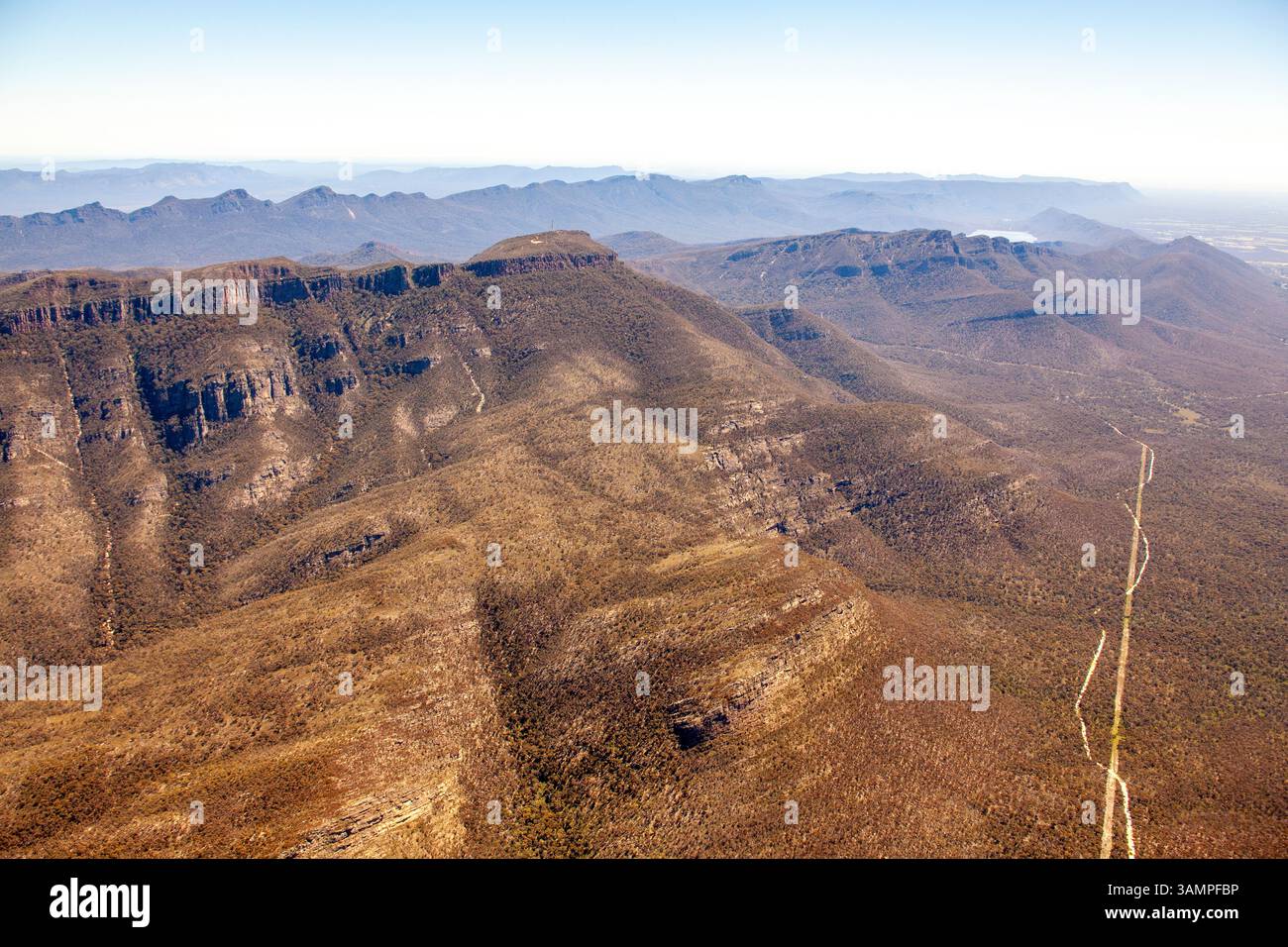 Aerial view of majestic mountains and a vast valley in a breathtaking ...