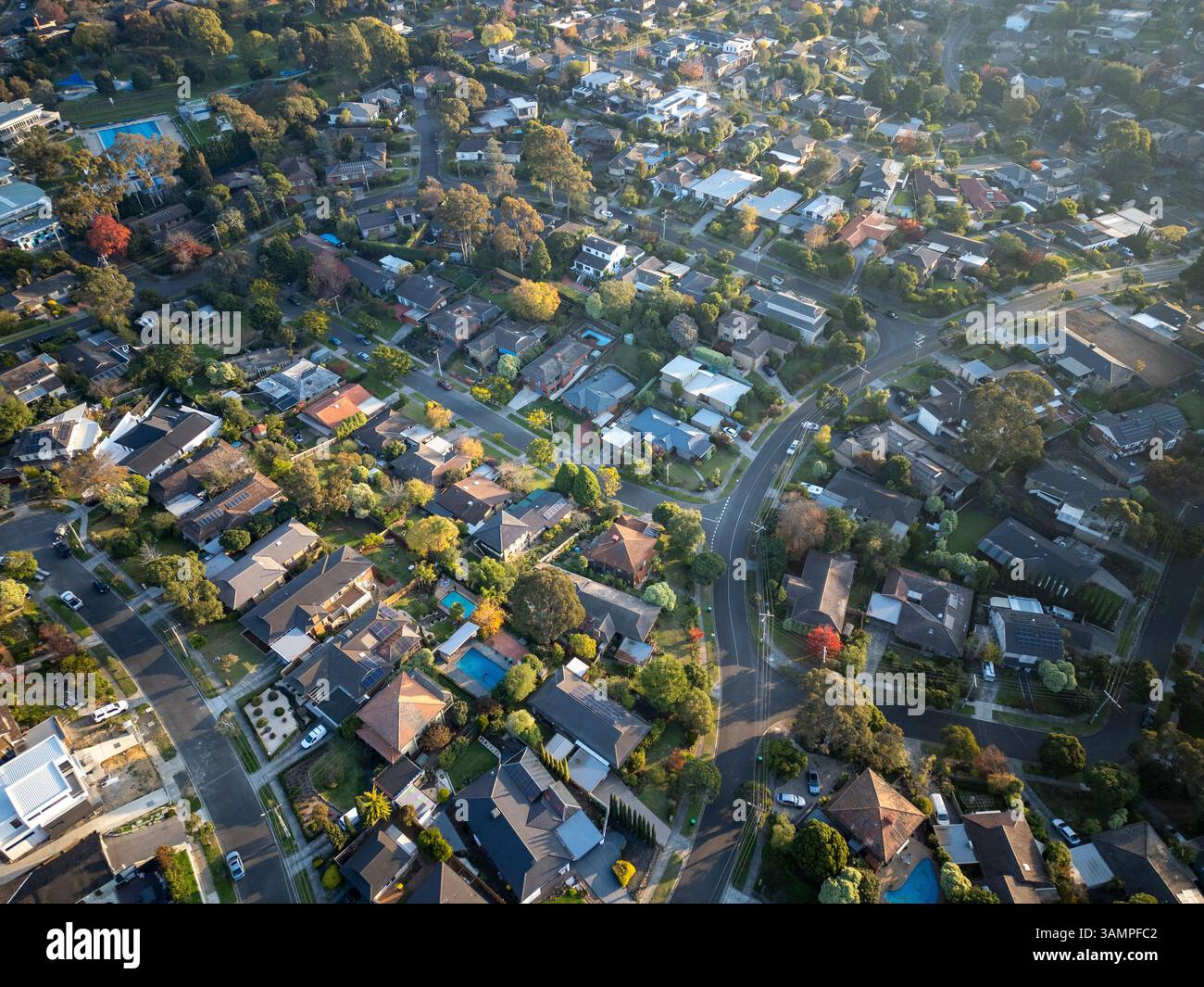Aerial view of beautiful suburban homes and green trees in Templestowe ...