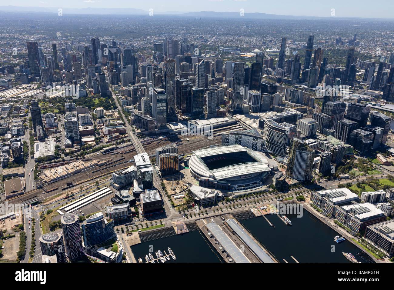 Aerial view of marvel stadium and urban skyline with waterfront in ...