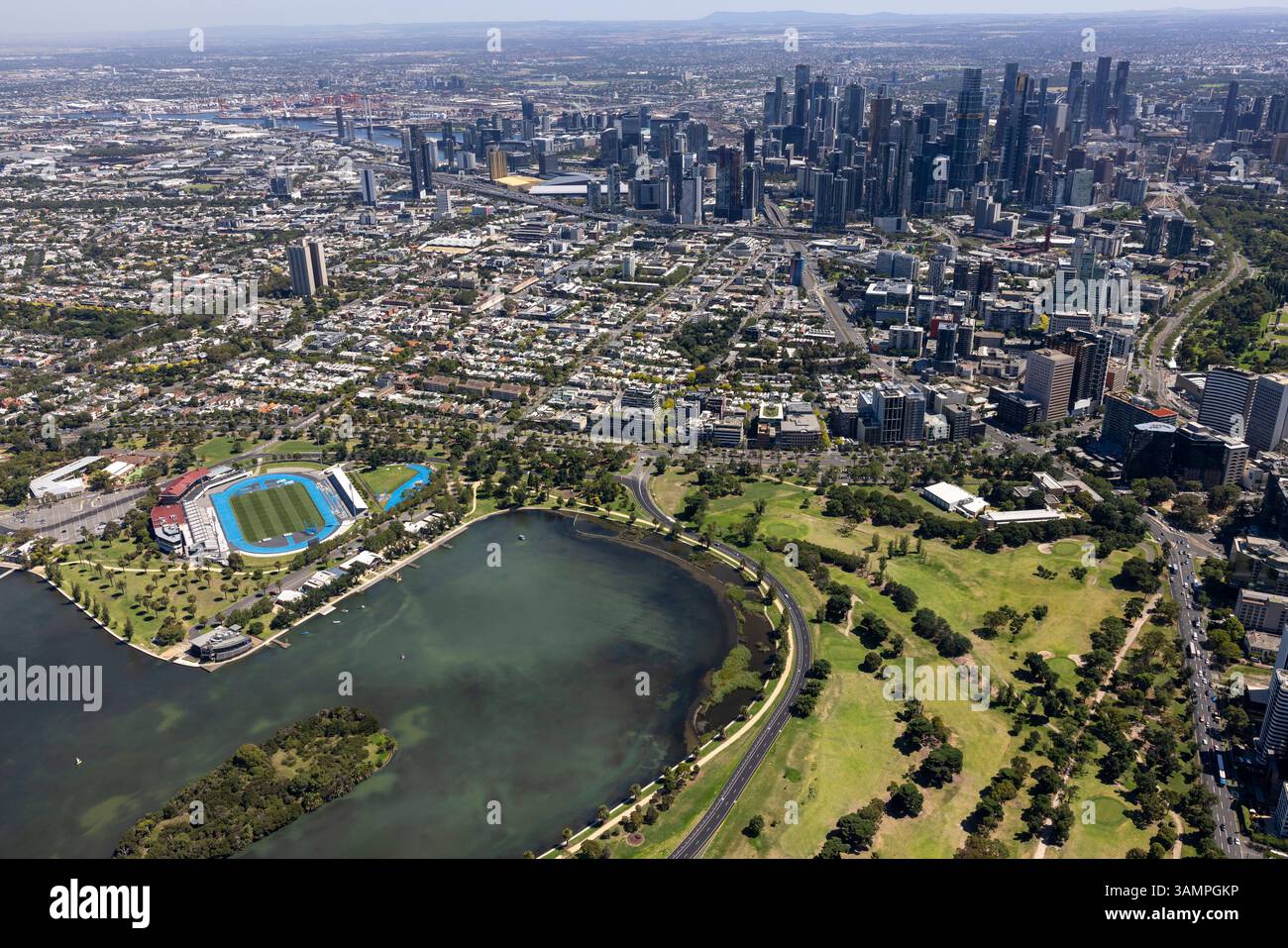 Aerial view of beautiful cityscape with skyscrapers, park, and lake ...