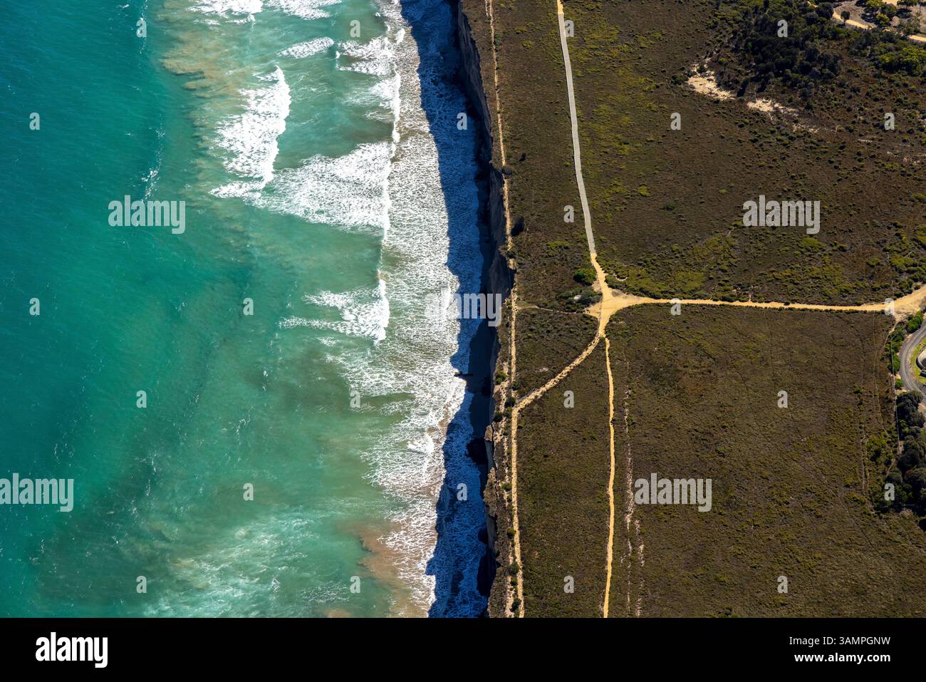 Aerial view of waves along the cliffs coastline in Anglesea, Victoria ...