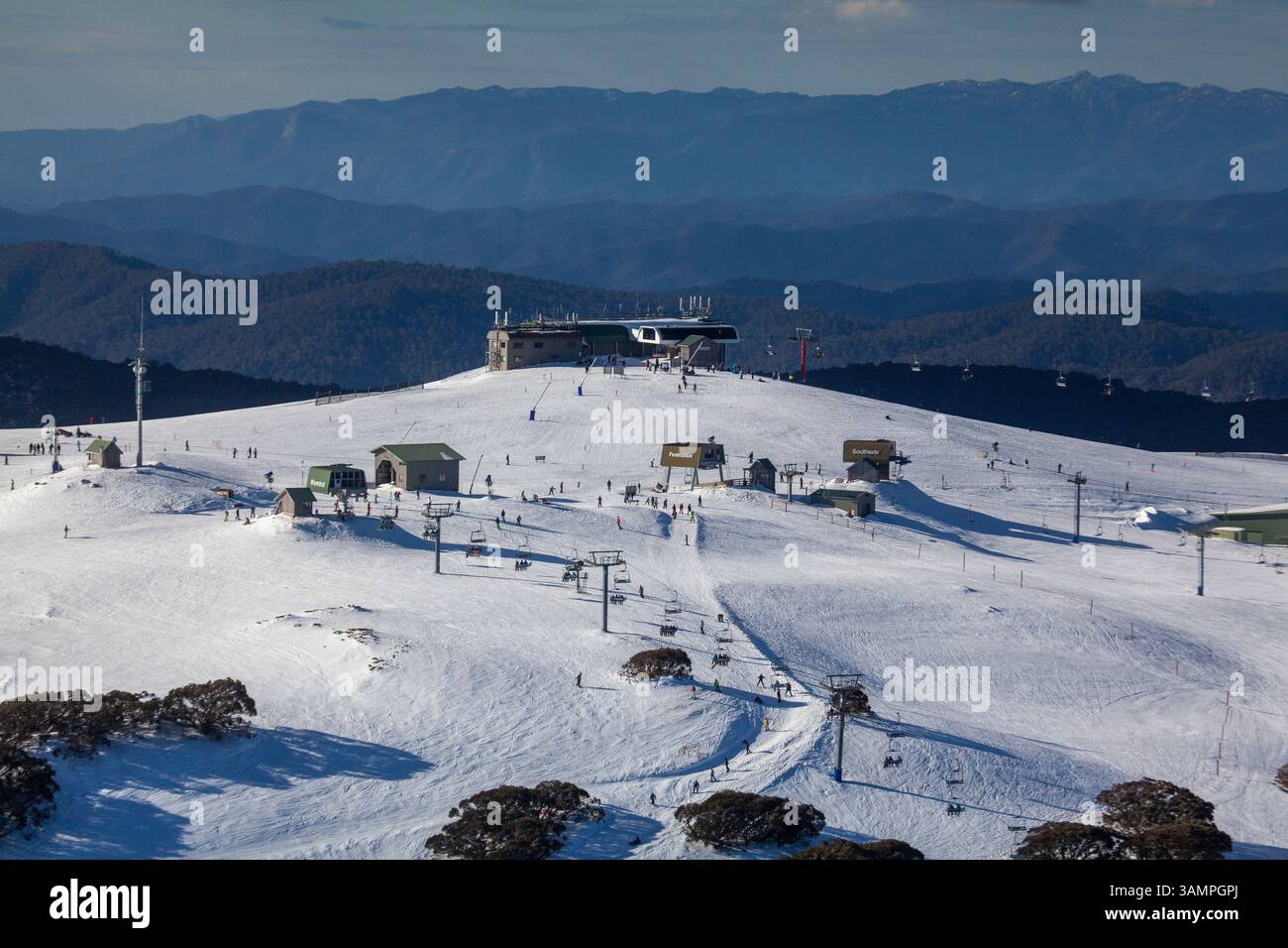 Aerial view of snowy landscape with ski resort and ski lifts, Mount ...