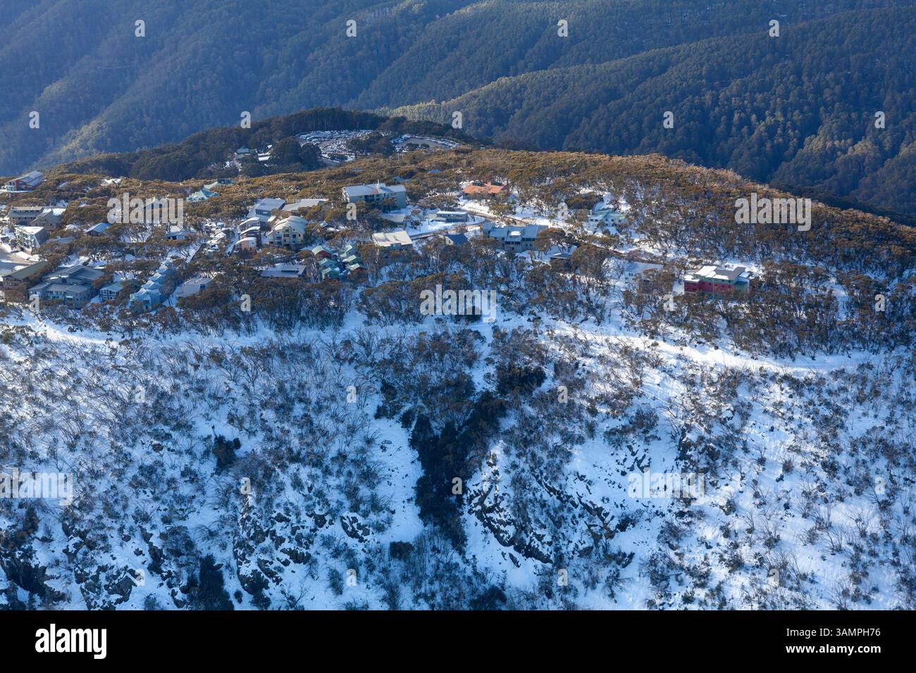 Aerial view of snowy Mount Buller ski resort surrounded by serene ...