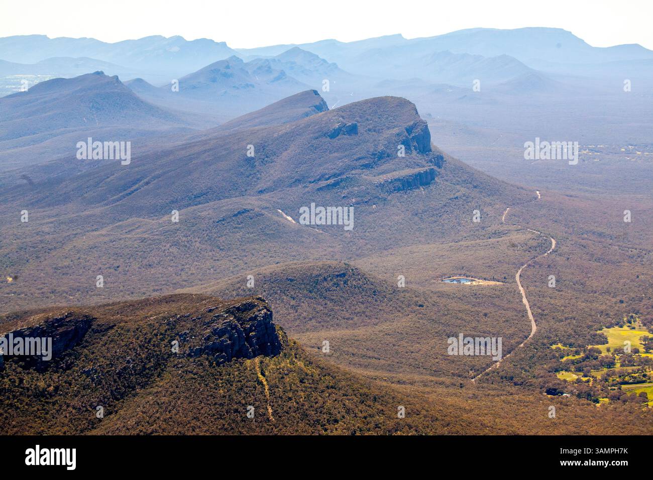 Aerial view of breathtaking rugged mountains and serene valleys with ...