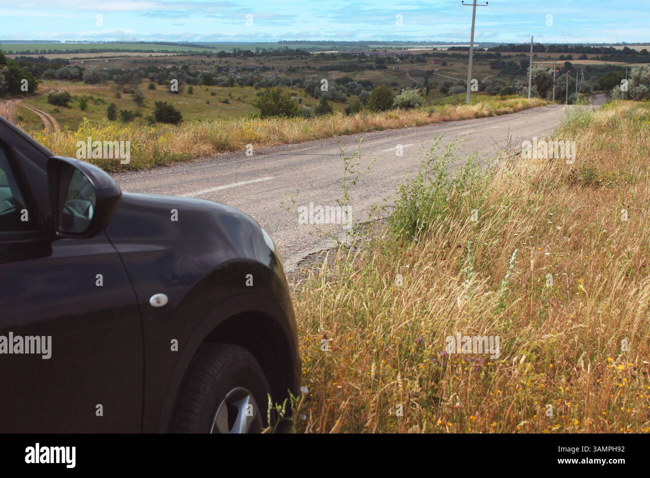 majestic panoramic view from the hill to the open spaces, road and car ...
