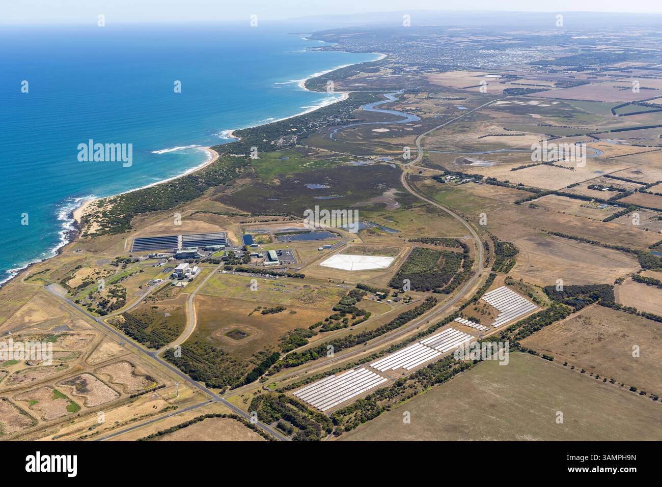 Aerial view of an industrial area along the coastline in Connewarre ...