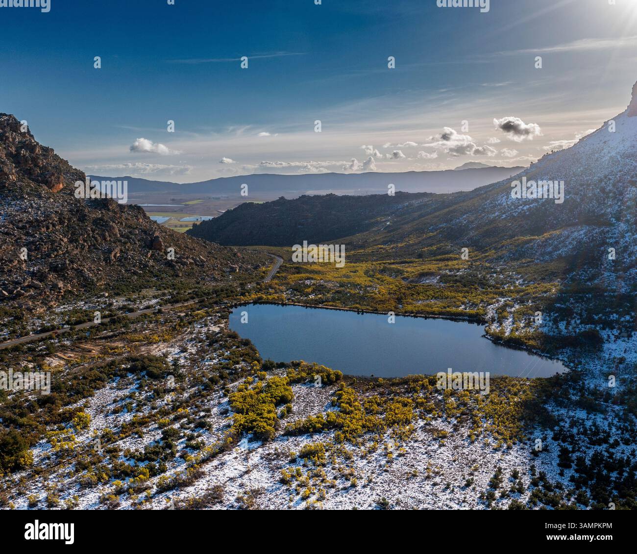 Aerial view of snow-covered mountains and serene lake in Witzenberg NU ...