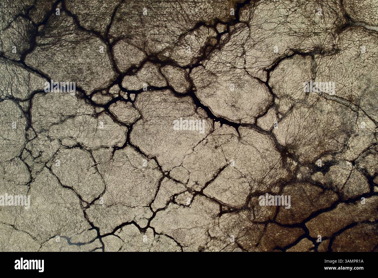 Aerial view of abstract and intricate patterns with cracked textures in ...