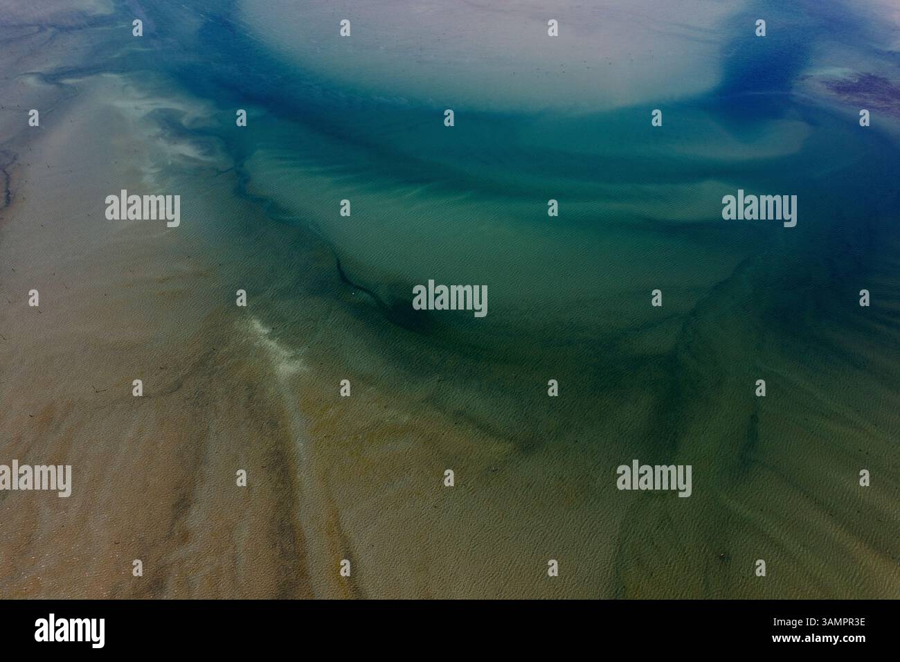 Aerial view of abstract tidal patterns in water, Forres, Scotland ...
