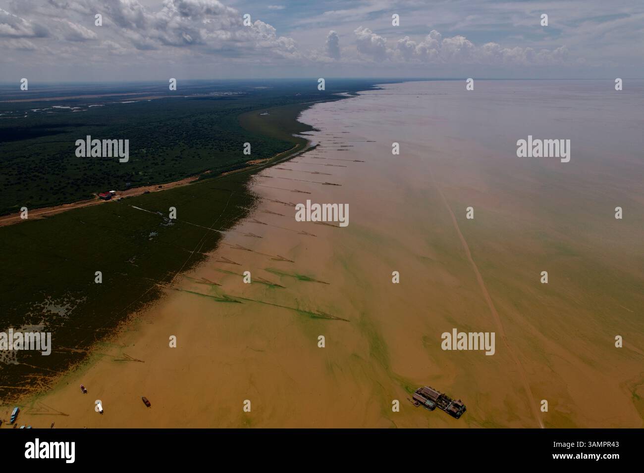 Aerial view of traditional fishing traps on Tonle Sap Lake surrounded ...